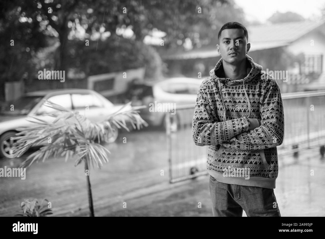 Young multi ethnic Asian man outdoors in black and white Stock Photo ...