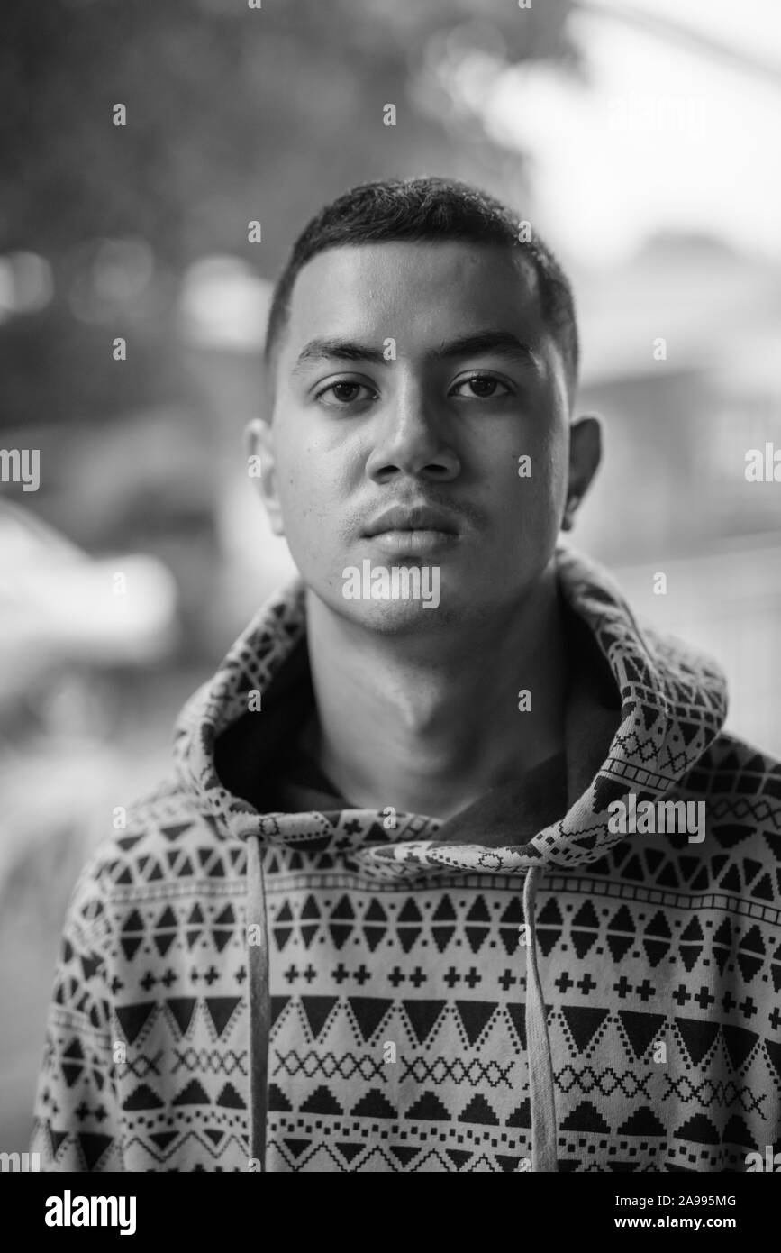 Young multi ethnic Asian man outdoors in black and white Stock Photo ...
