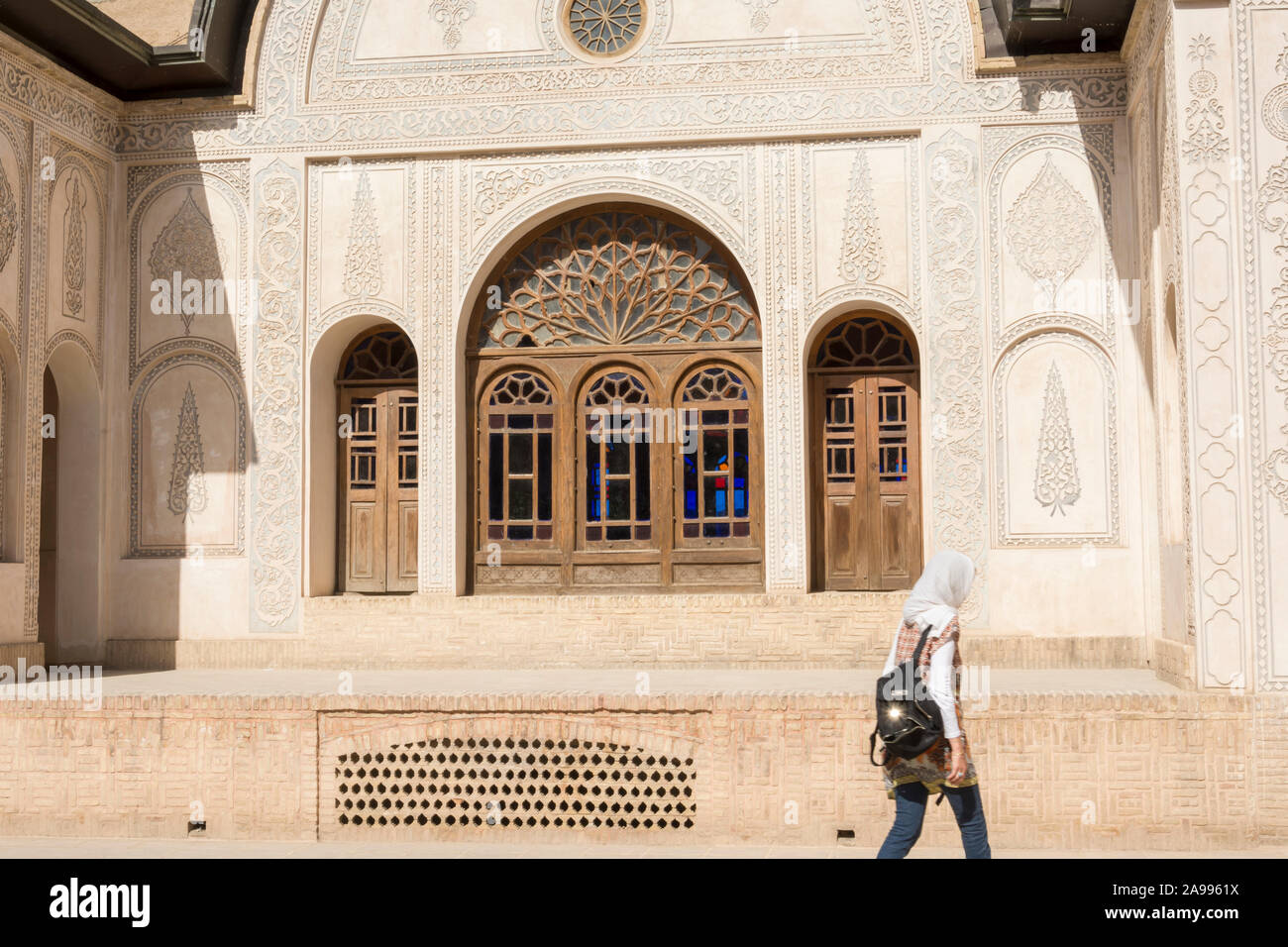Traditional Persian courtyard, tourist visiting the Tabatabaei house ...