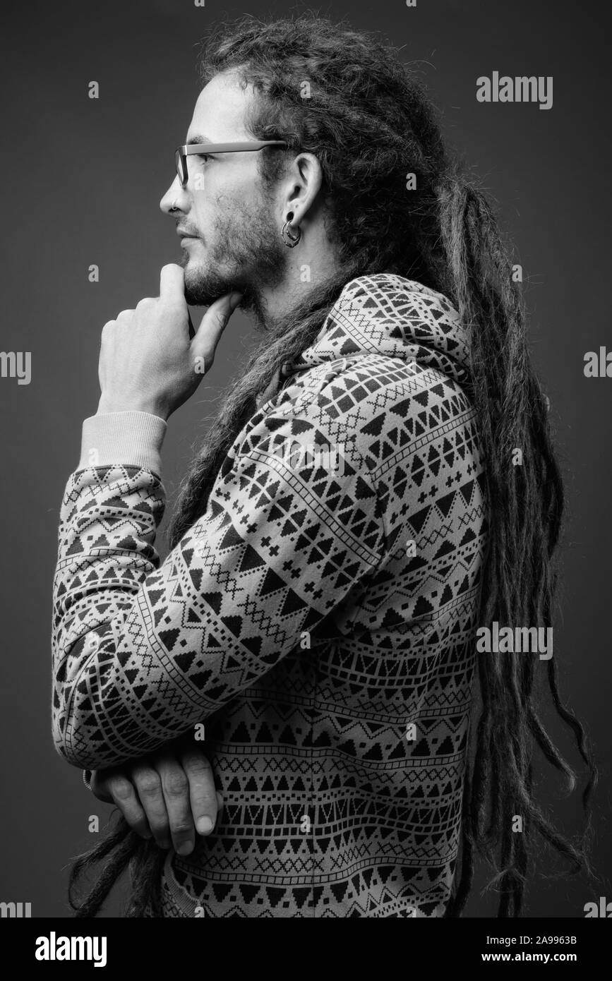 Young handsome Hispanic man with dreadlocks in black and white Stock ...