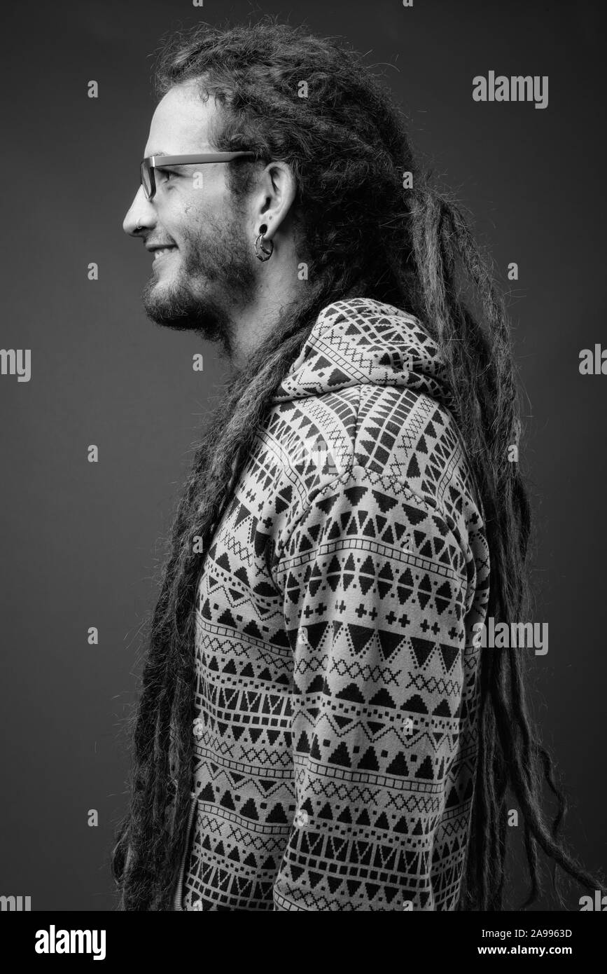 Young handsome Hispanic man with dreadlocks in black and white Stock ...