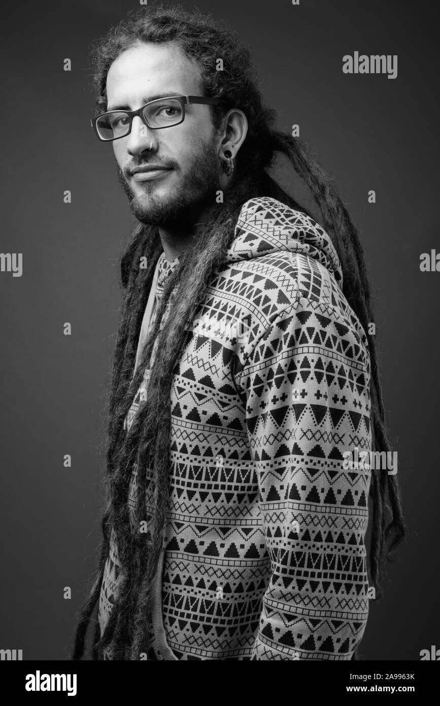 Young handsome Hispanic man with dreadlocks in black and white Stock ...