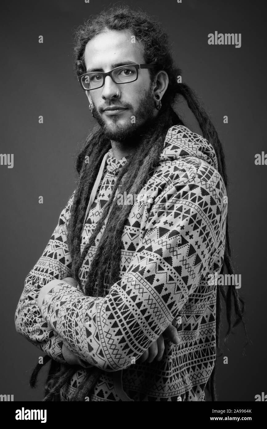 Young handsome Hispanic man with dreadlocks in black and white Stock ...