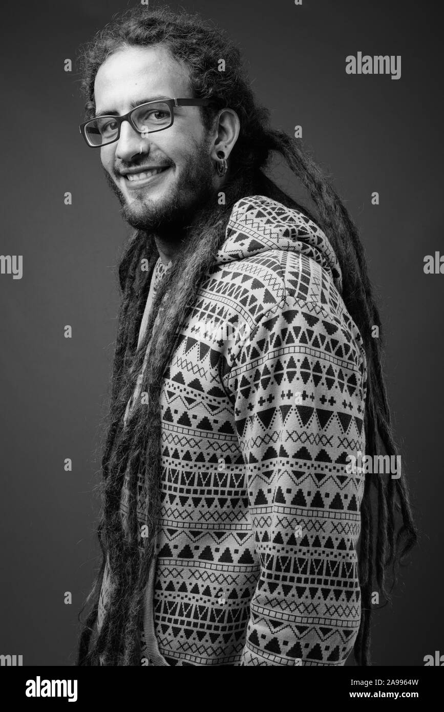 Young handsome Hispanic man with dreadlocks in black and white Stock ...