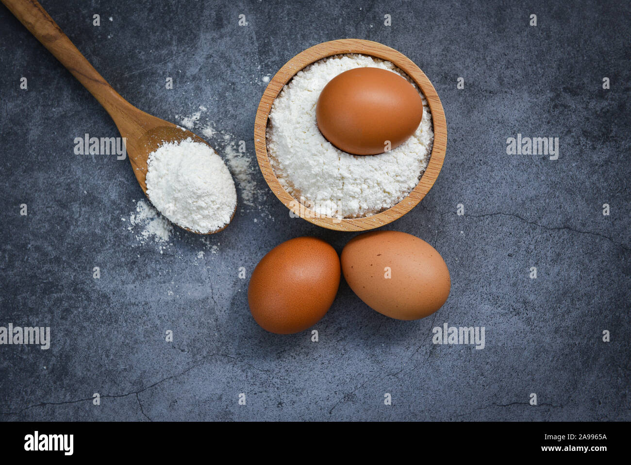 Homemade flour eggs cooking ingredients on kitchen table / Pastry flour ...