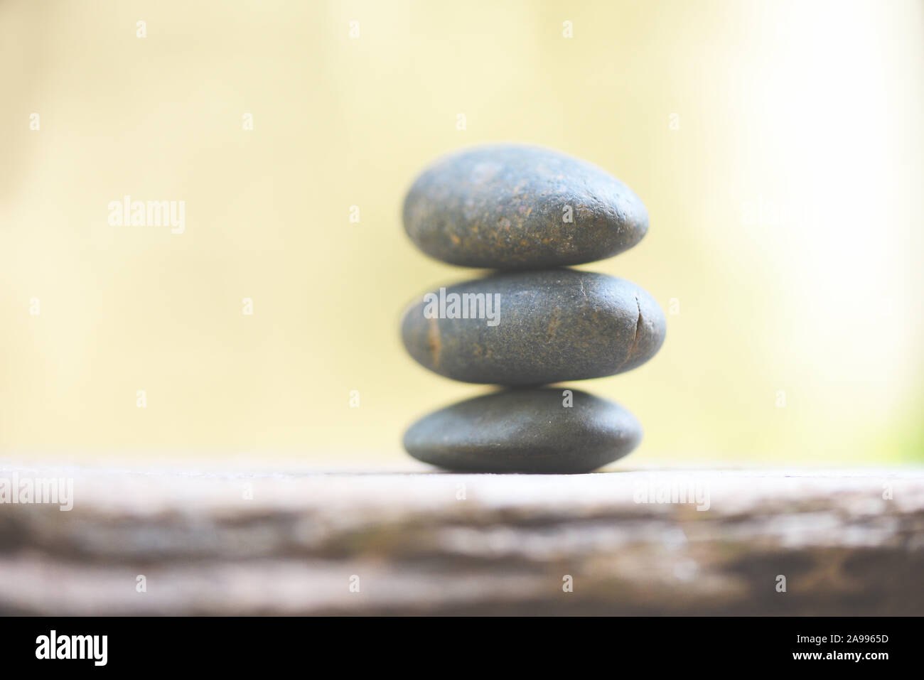 Natural wellness concept / Relax zen stones stack on wooden nature ...