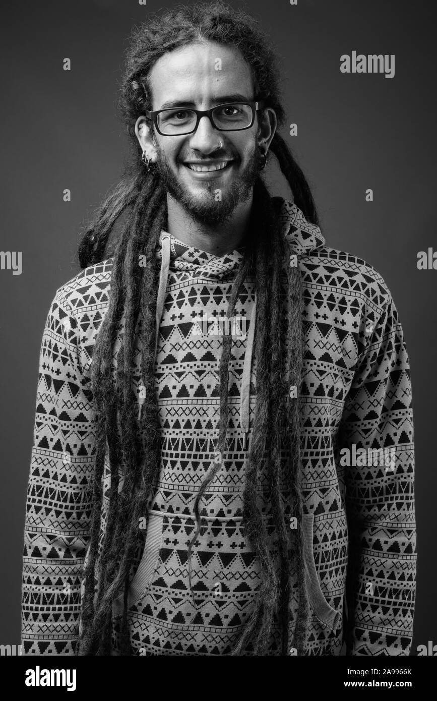 Young handsome Hispanic man with dreadlocks in black and white Stock ...