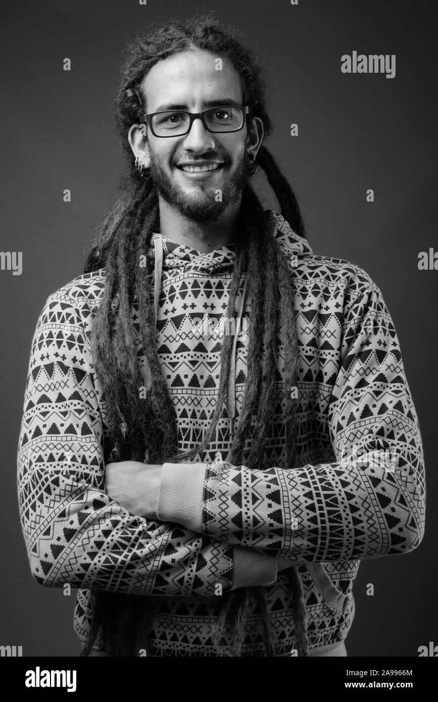 Young handsome Hispanic man with dreadlocks in black and white Stock ...
