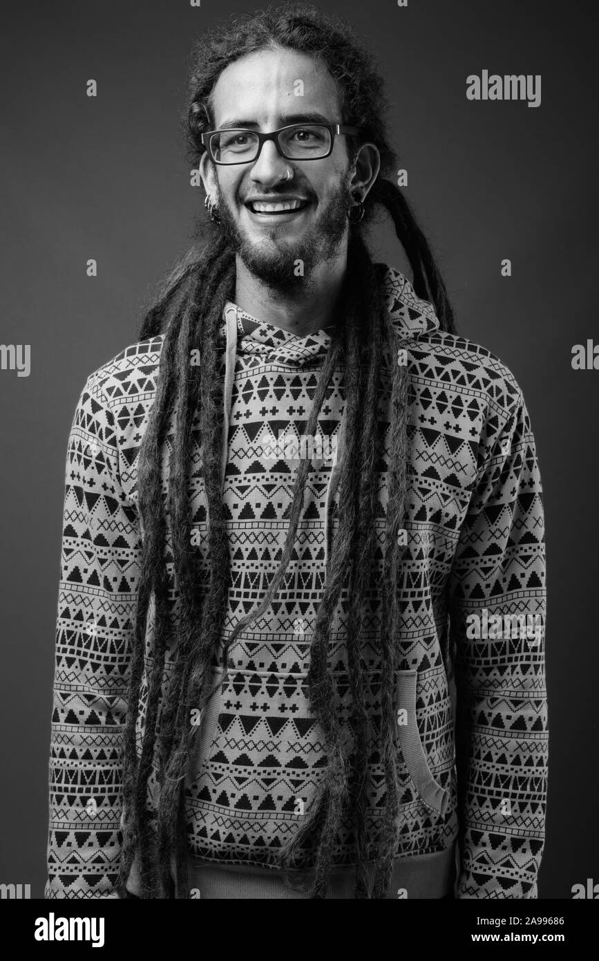 Young handsome Hispanic man with dreadlocks in black and white Stock ...