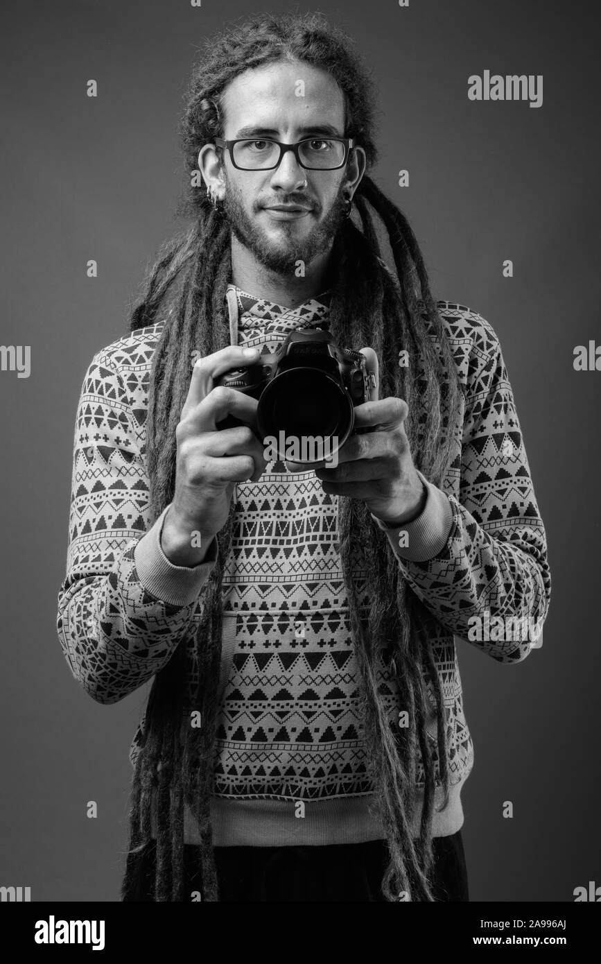 Young handsome Hispanic man with dreadlocks in black and white Stock ...
