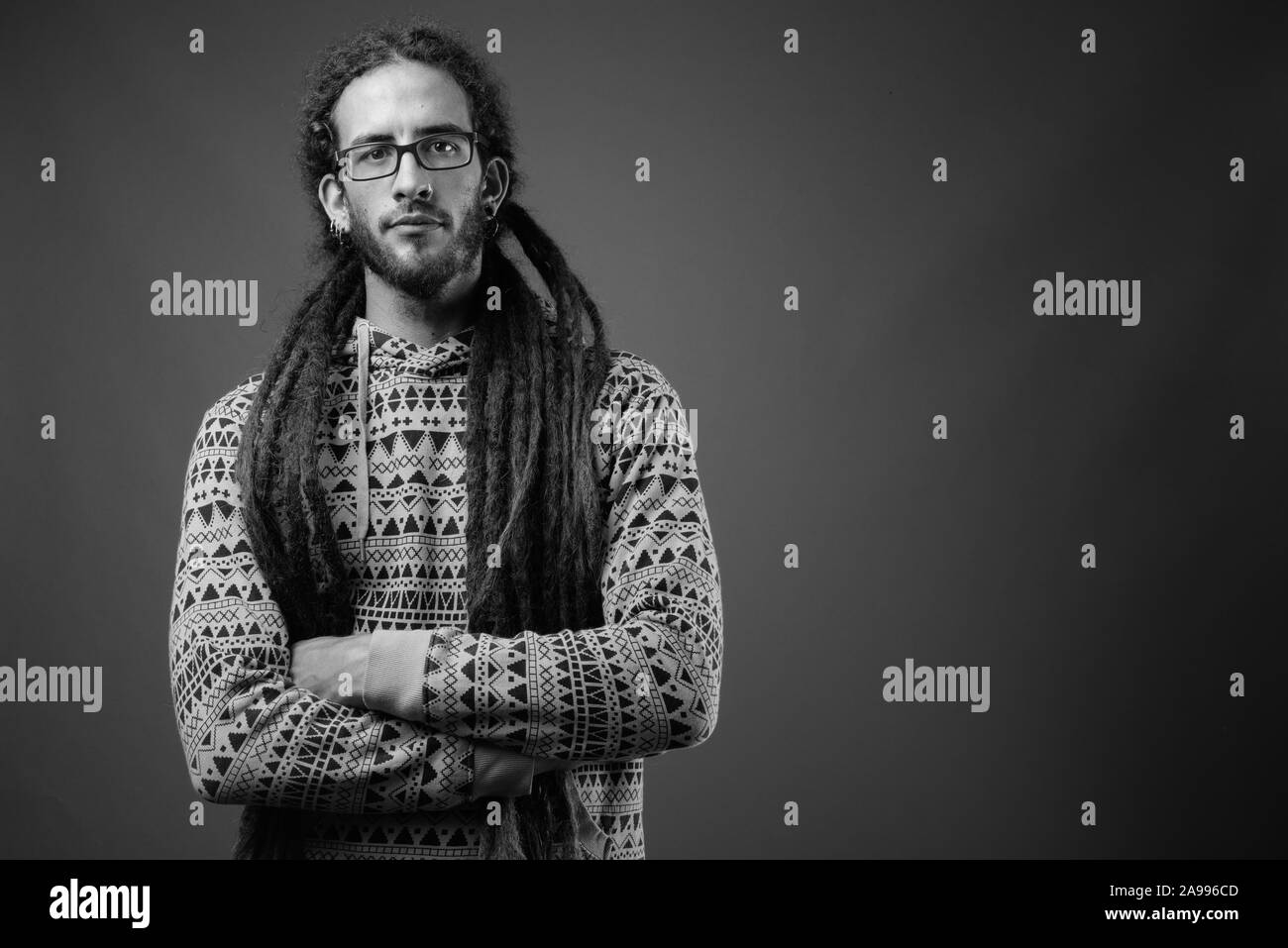 Young handsome Hispanic man with dreadlocks in black and white Stock ...