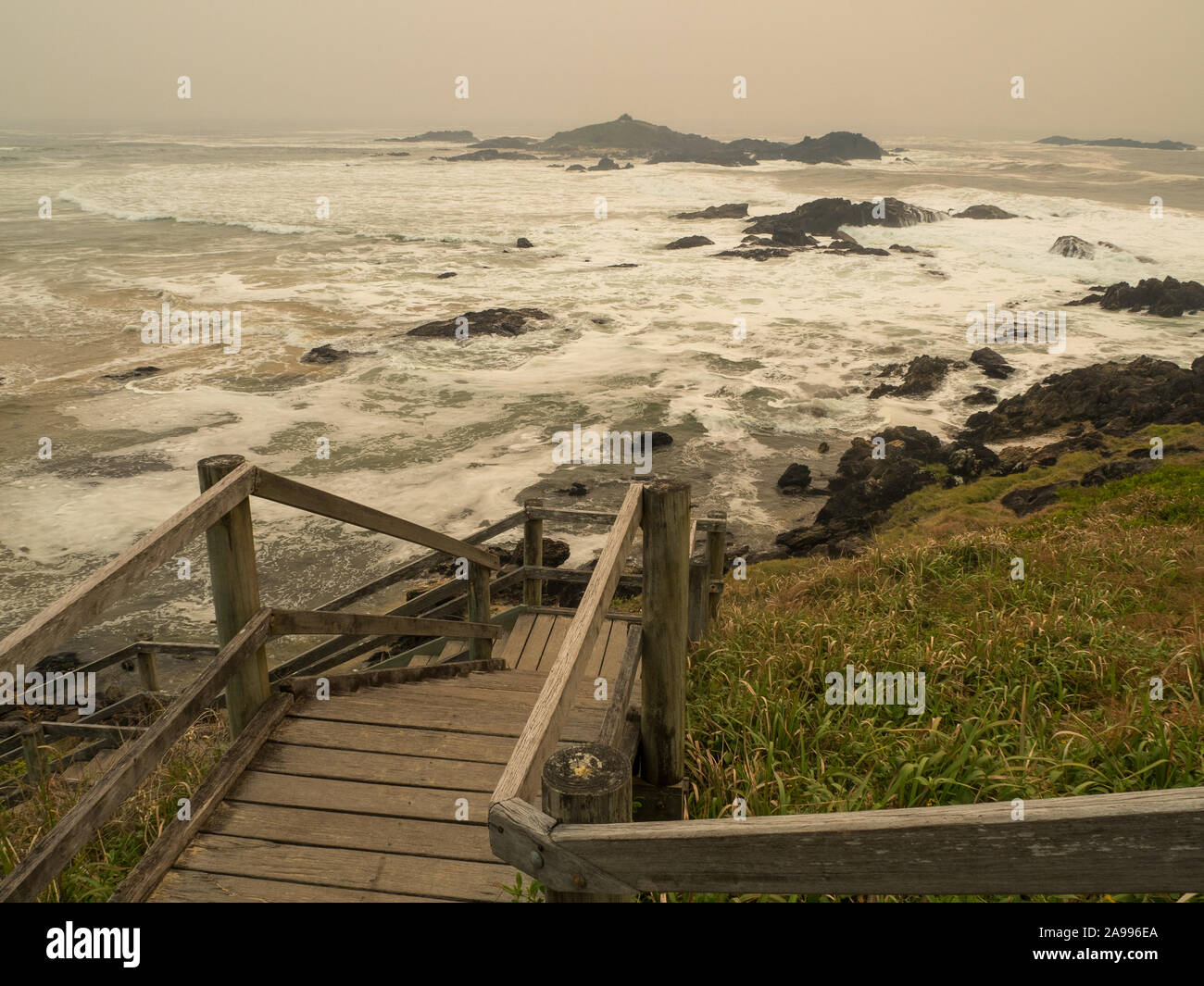 A smokey seascape as viewed from the steps leading down to the beach ...