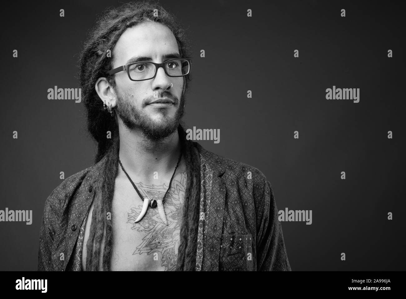 Young handsome Hispanic man with dreadlocks in black and white Stock ...