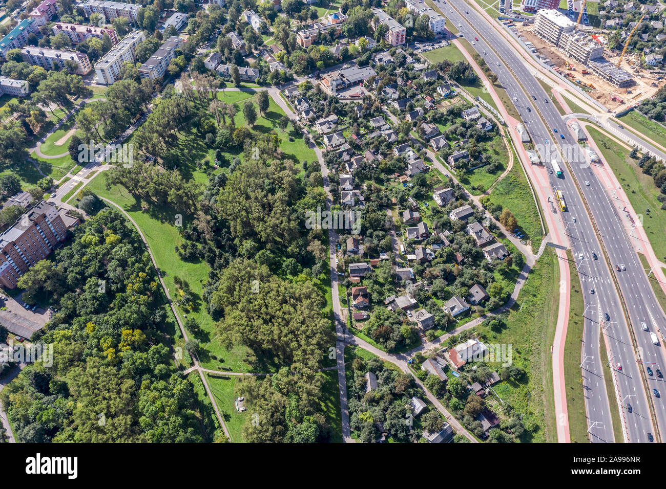 aerial panoramic view of city suburbs with residential houses at sunny ...