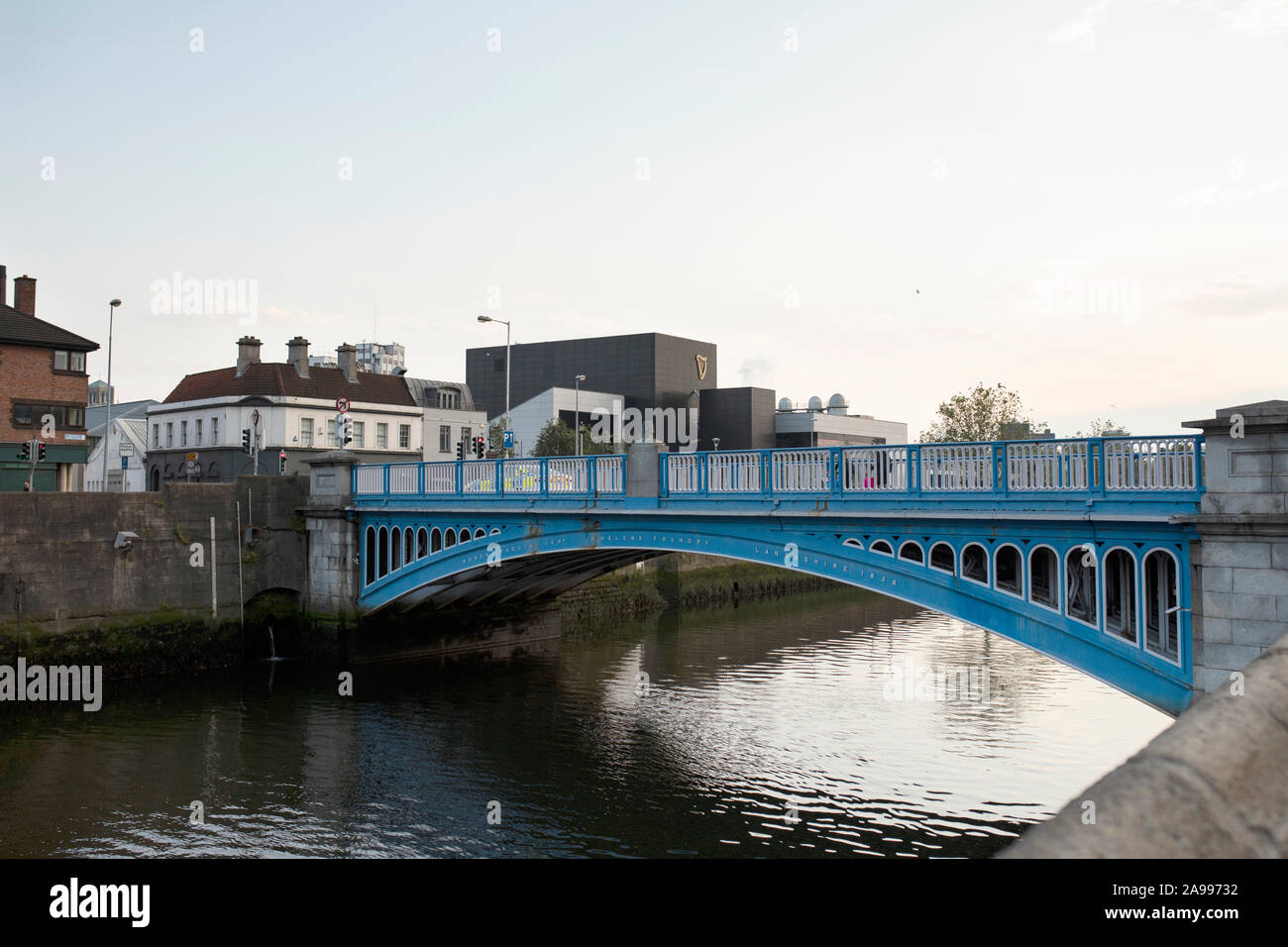 The Rory Omore bridge over the River Liffey at sunset in Dublin ...