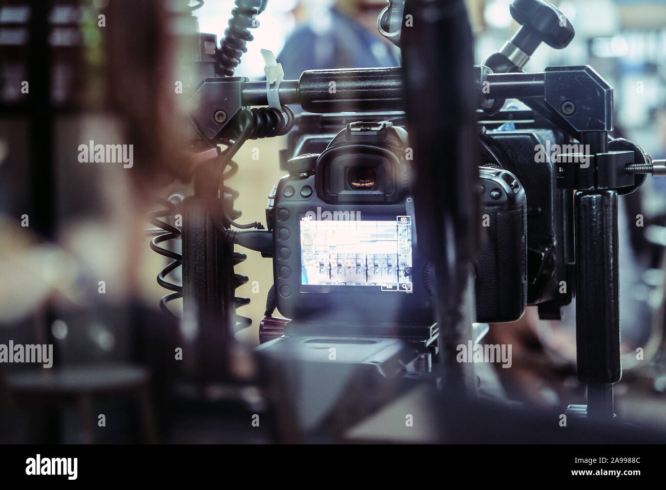 filming crew. cameraman shooting film scene with camera Stock Photo - Alamy