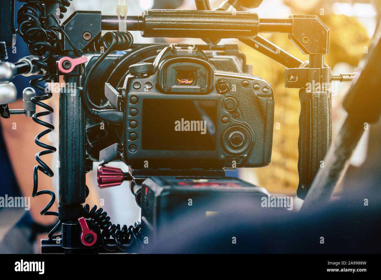 filming crew. cameraman shooting film scene with camera Stock Photo - Alamy
