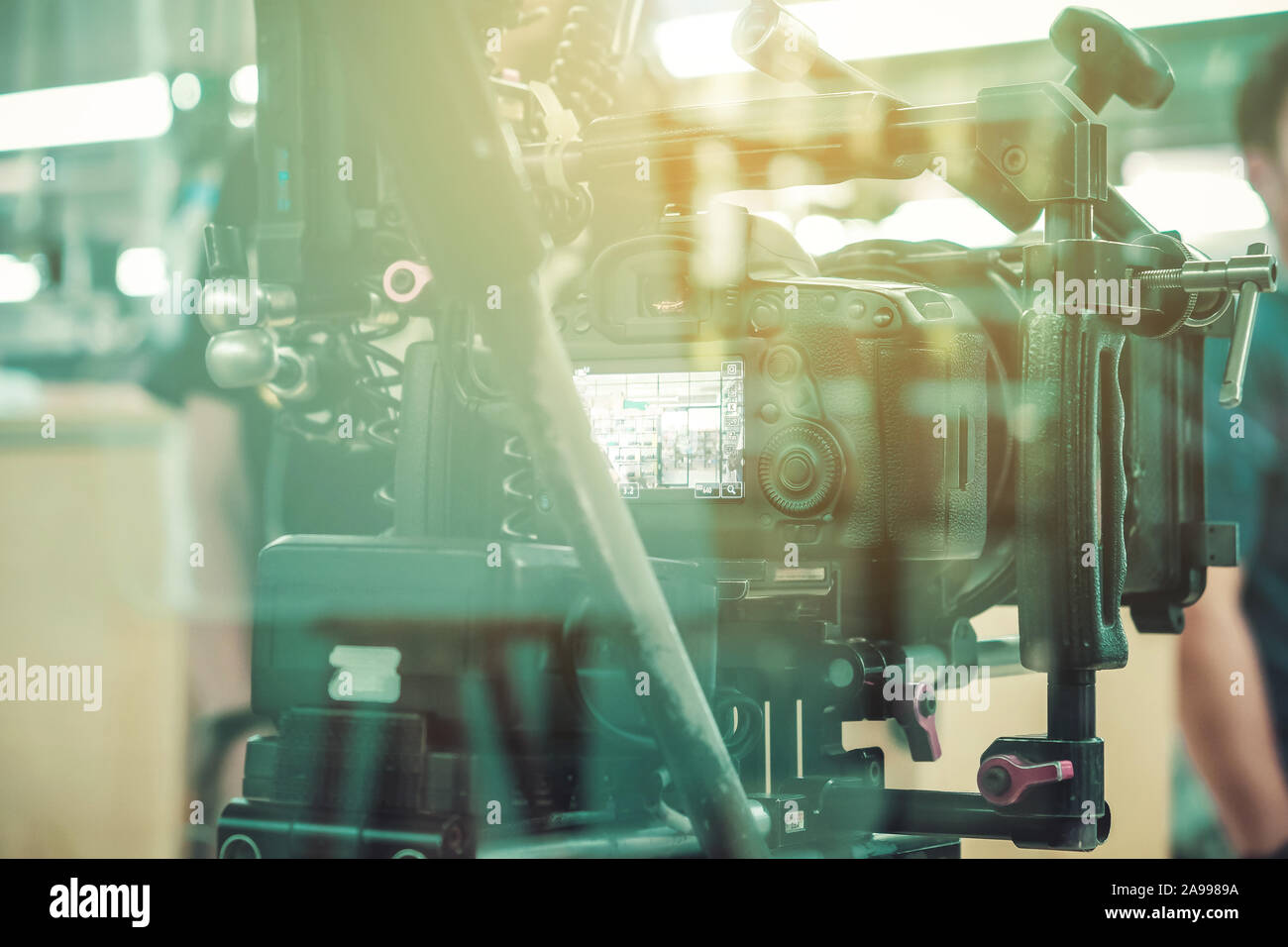 filming crew. cameraman shooting film scene with camera Stock Photo - Alamy