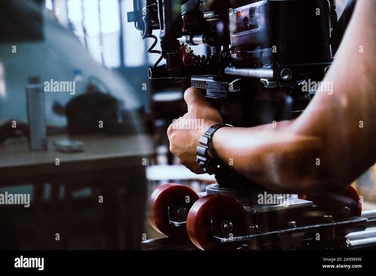 filming crew. cameraman shooting film scene with camera Stock Photo - Alamy