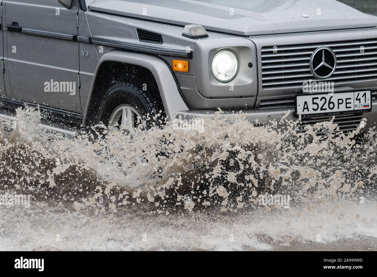 Close-up view of Mercedes-Benz G-Class, G-Wagen driving on flooded road ...