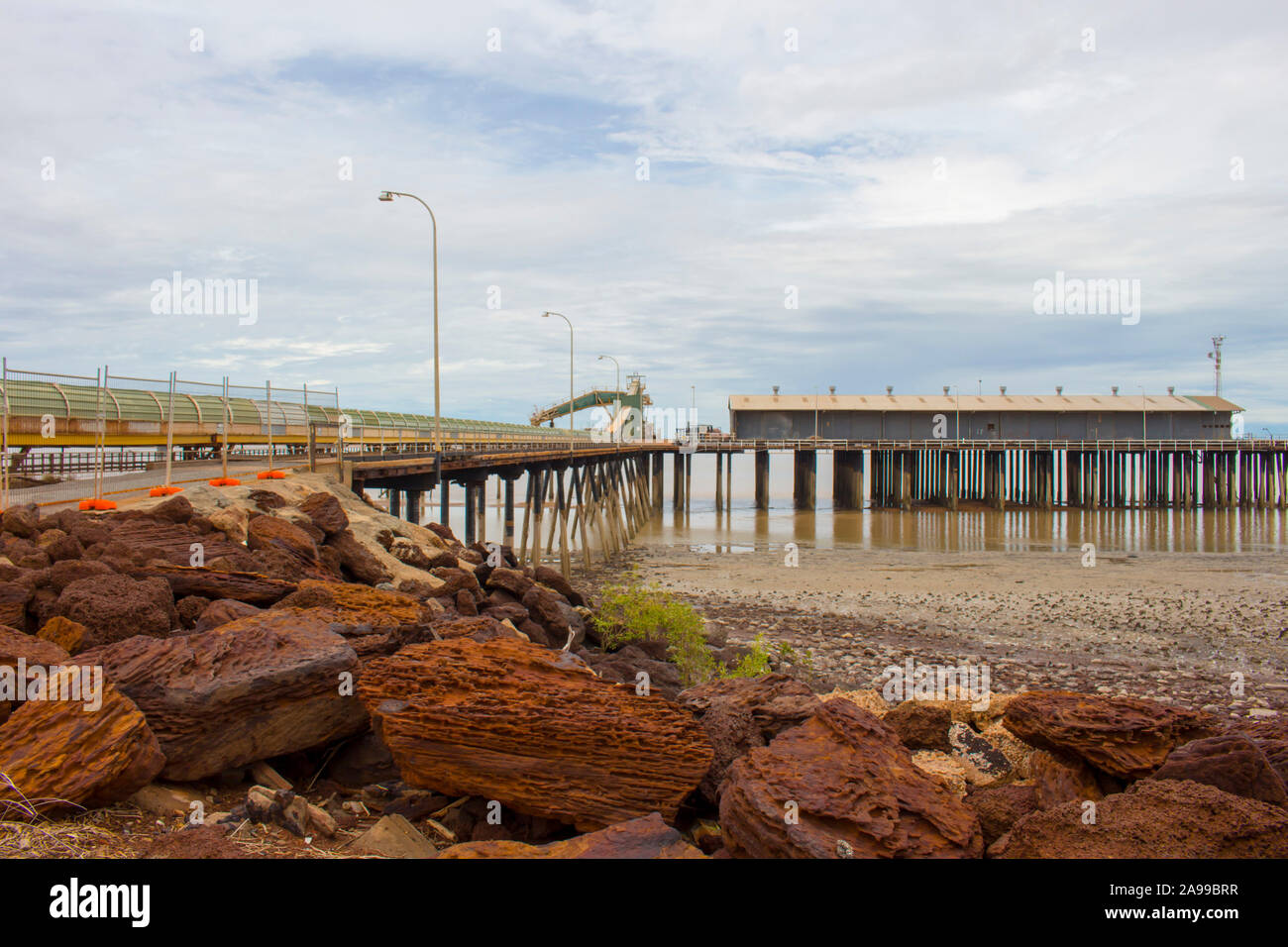 The long jetty with the muddy water ebbing out where King Sound ends in ...