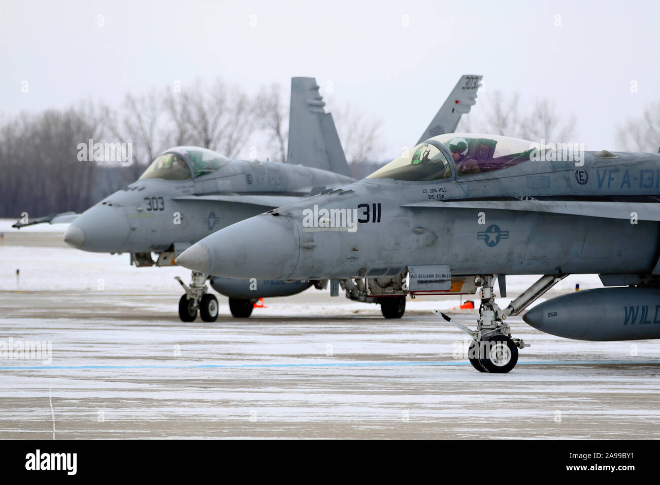 United States Navy F-18 Hornets prepare for a flyover during a Green ...