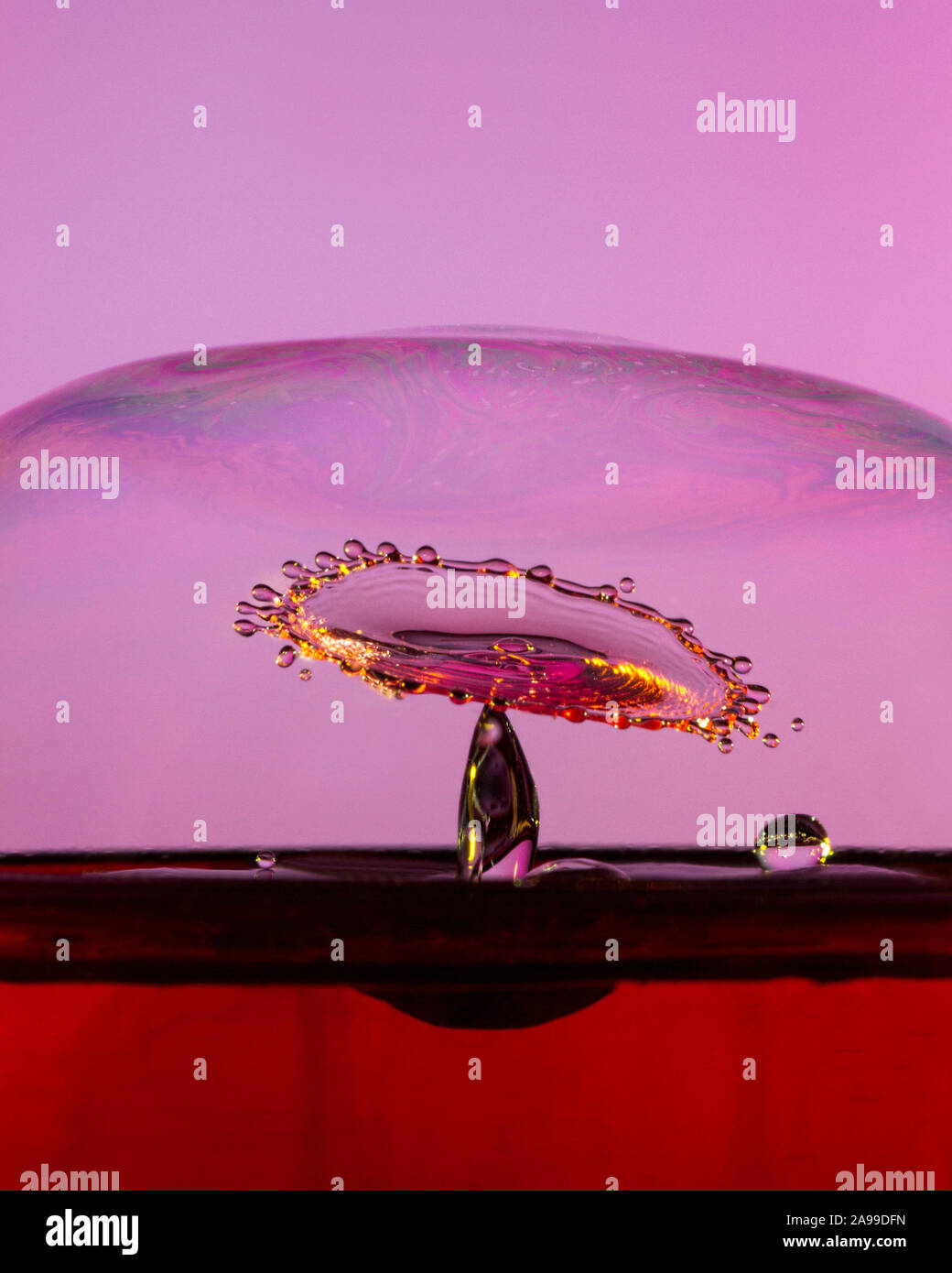 Two drops water collide form hi-res stock photography and images - Alamy