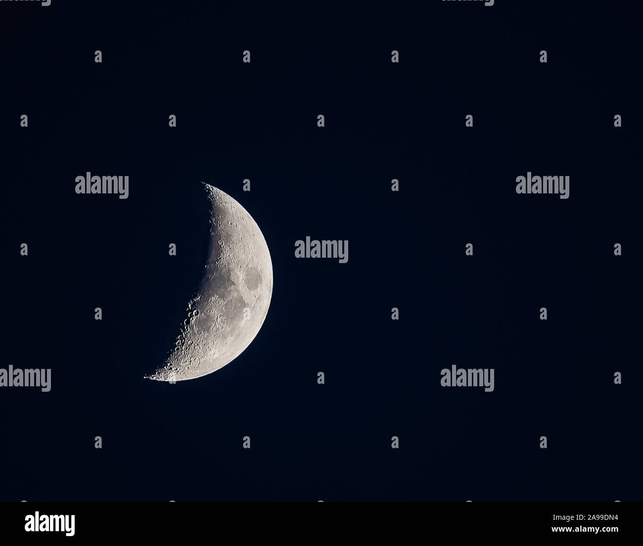 Waxing crescent moon phase, dark blue night sky Stock Photo - Alamy