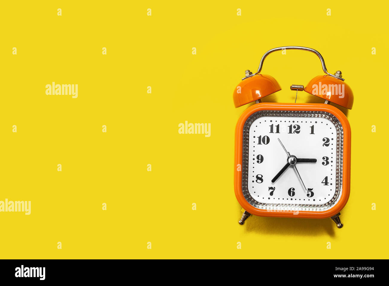 orange alarm clock isolated Stock Photo - Alamy