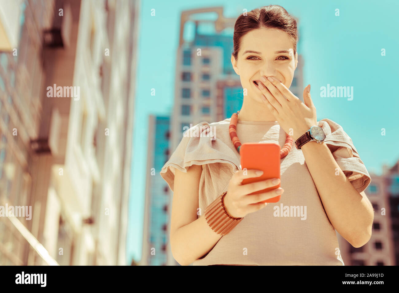 Positive delighted female person looking straight at camera Stock Photo ...