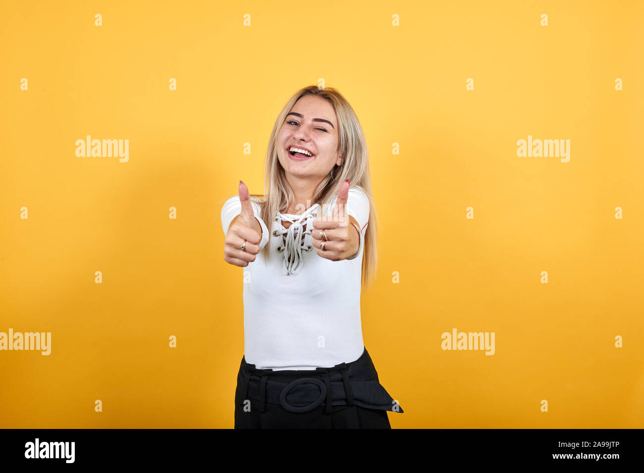 Pretty young girl celebrating a victory in winner position, keeping ...