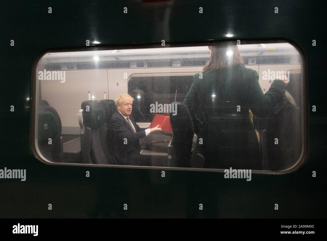 Prime Minister Boris Johnson boards a train at Paddington train station ...