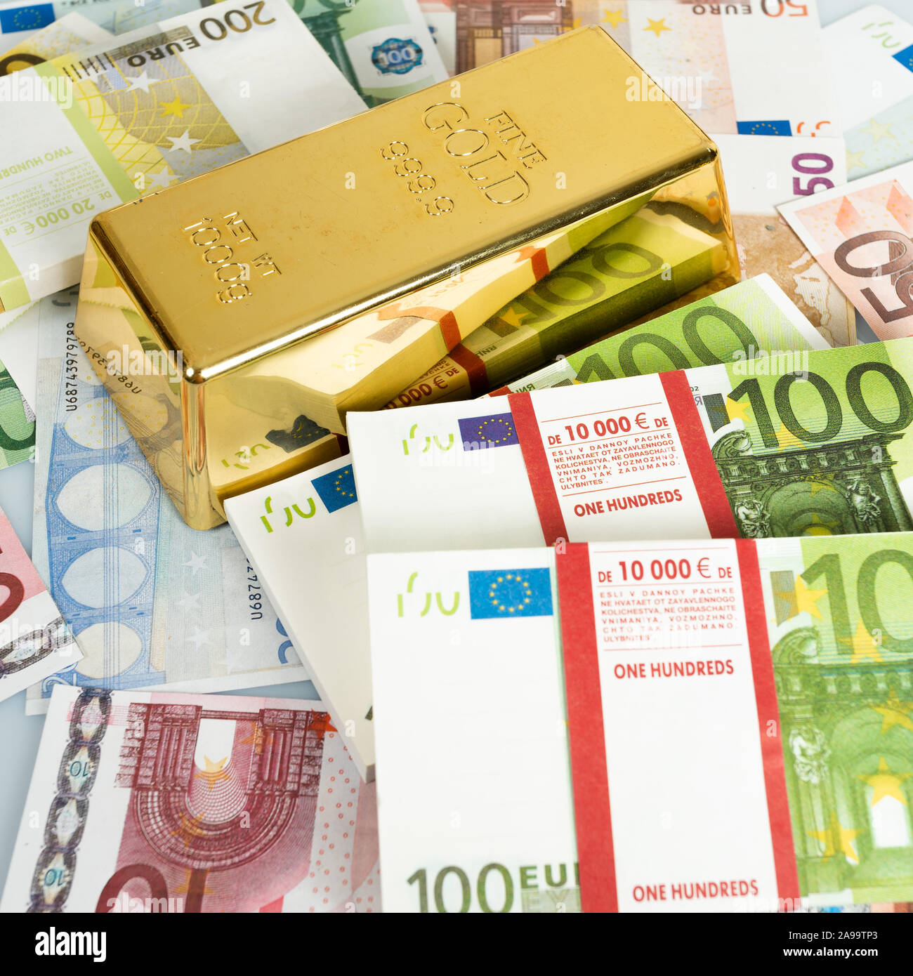 Gold bars and Euro banknotes. Gold bullion and money Stock Photo - Alamy