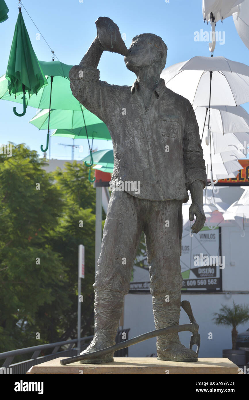 Sculpture of local man playing the conch in Torrox, Spain Stock Photo ...