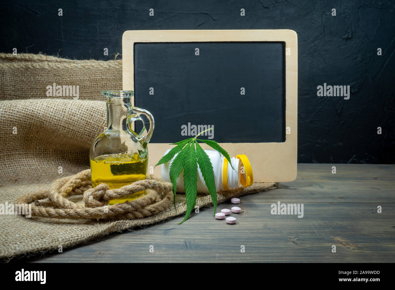 Marijuana and drug abuse or addiction still life with a fresh green ...