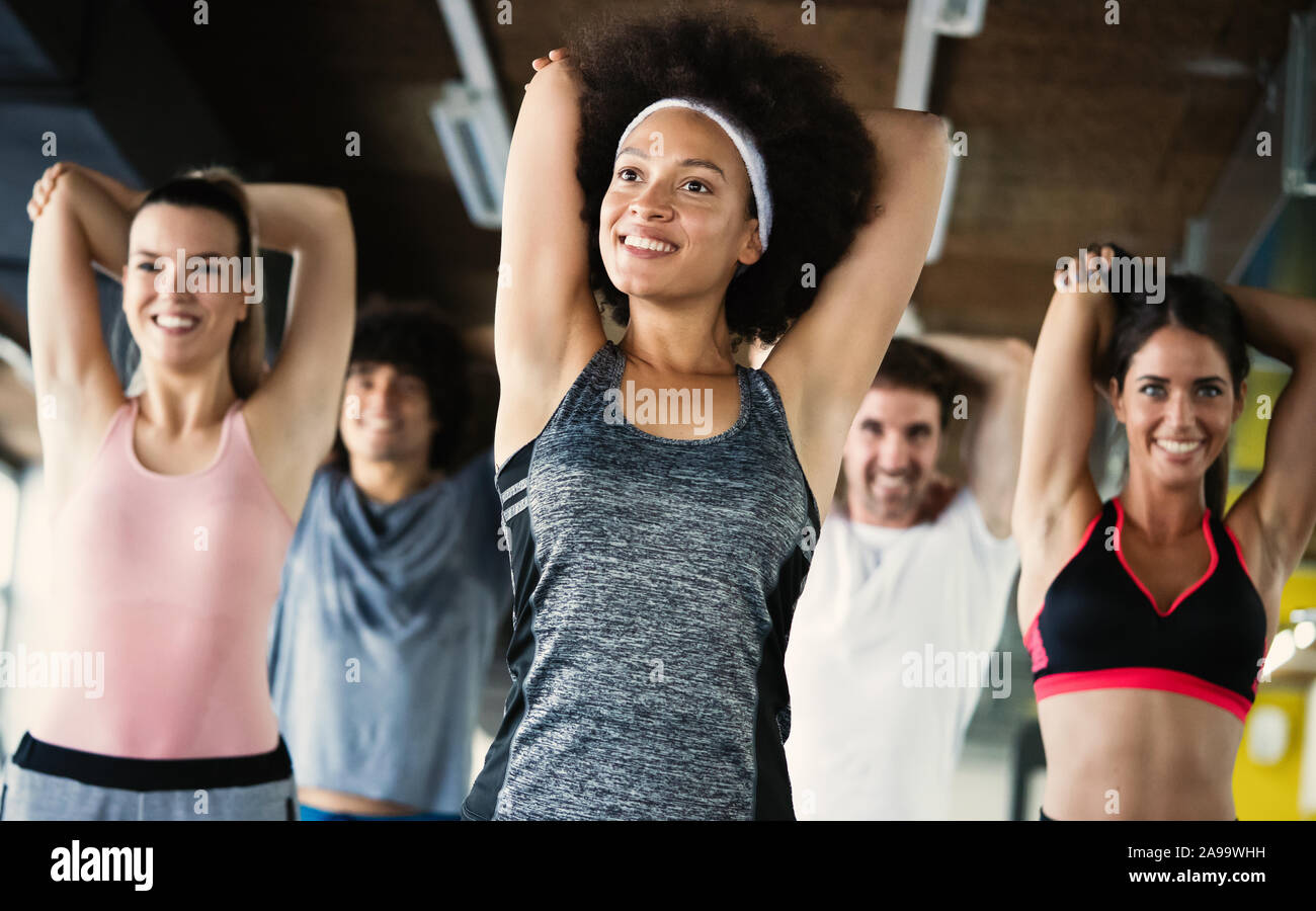 Group of fit people at the gym exercising Stock Photo - Alamy