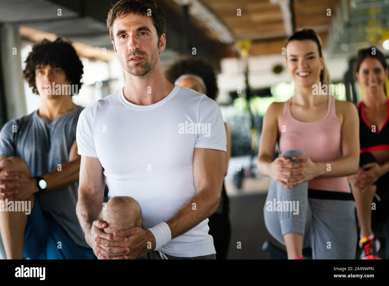 Team workout in gym to reach goals Stock Photo - Alamy