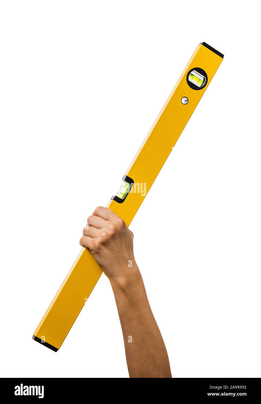 A hand raised up holds a building level isolated on a white background ...