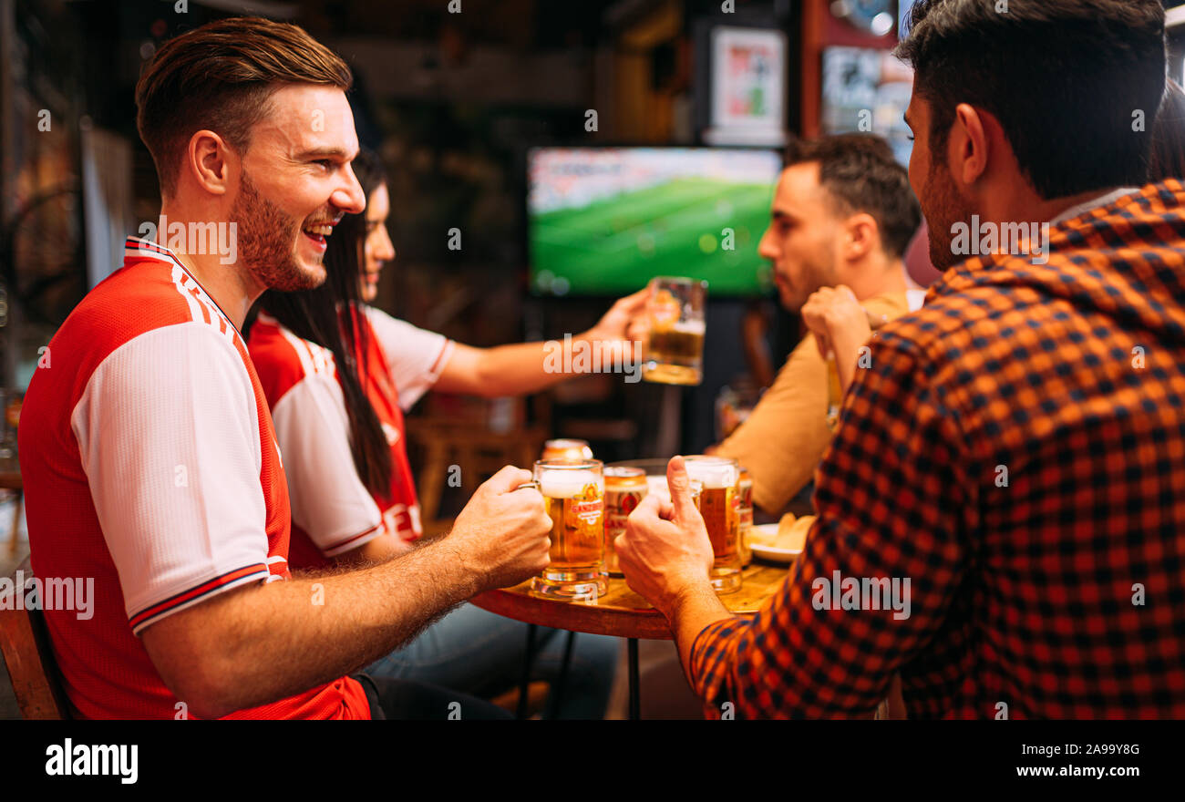 Party excited arsenal fans watching soccer with Ganzberg Beer in the ...