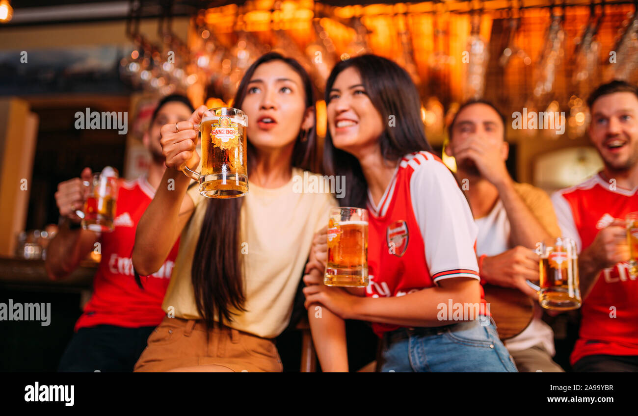 Party excited arsenal fans watching soccer with Ganzberg Beer in the ...