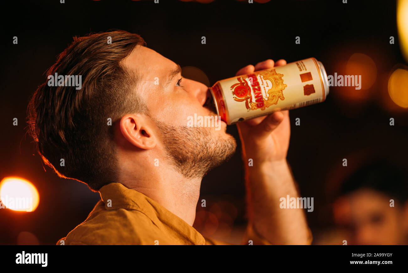 party friends drinking ganzberg beer at bar or pub Stock Photo - Alamy