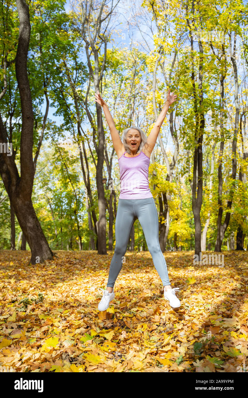 Lady jumping hi-res stock photography and images - Alamy