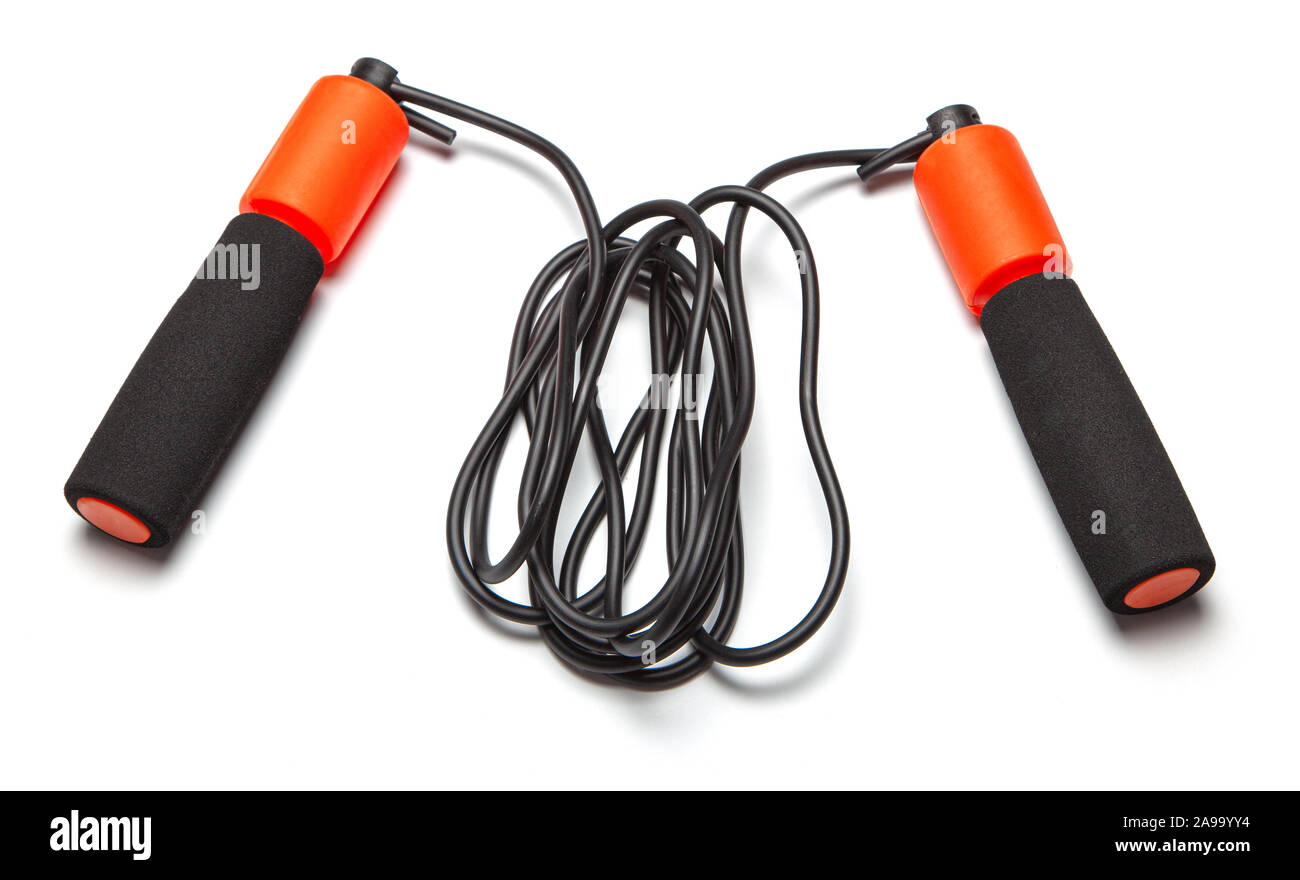 Jump rope. Fun exercises for body health. Orange rope with black cord ...
