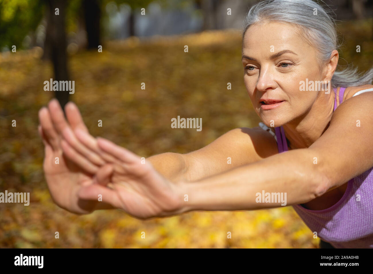 Relaxed attractive lady stretching her back muscles Stock Photo - Alamy