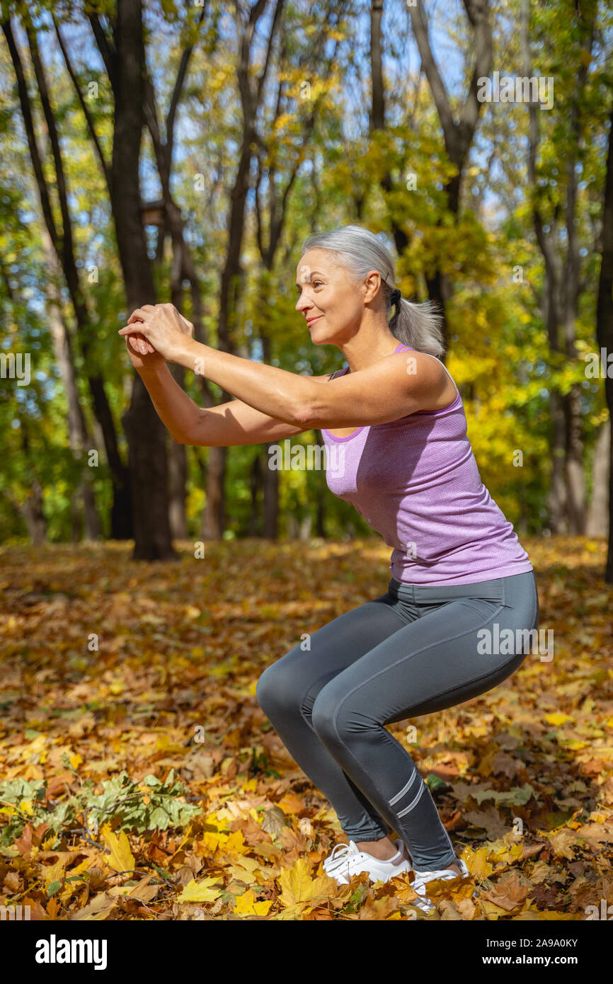 Lady doing squats hi-res stock photography and images - Alamy