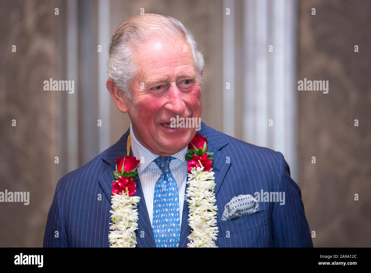 The Prince of Wales wears a flower garland during a British Asian Trust ...