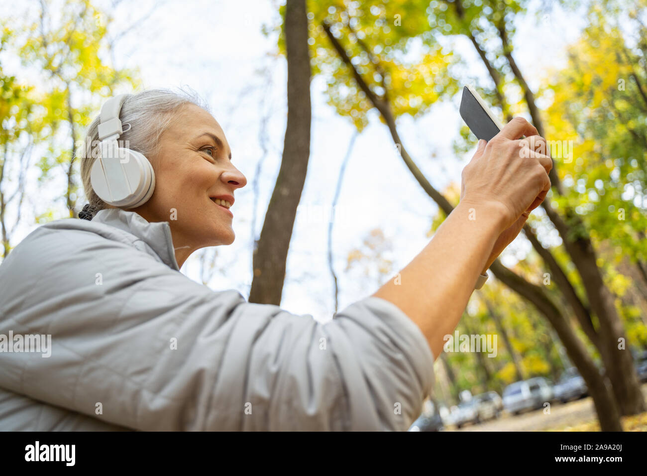 Focused mature lady using hi-res stock photography and images - Alamy