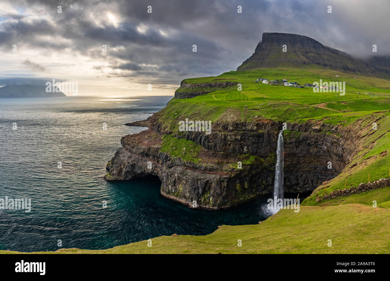Gasadalur waterfall wide angle with Mykines island Stock Photo - Alamy