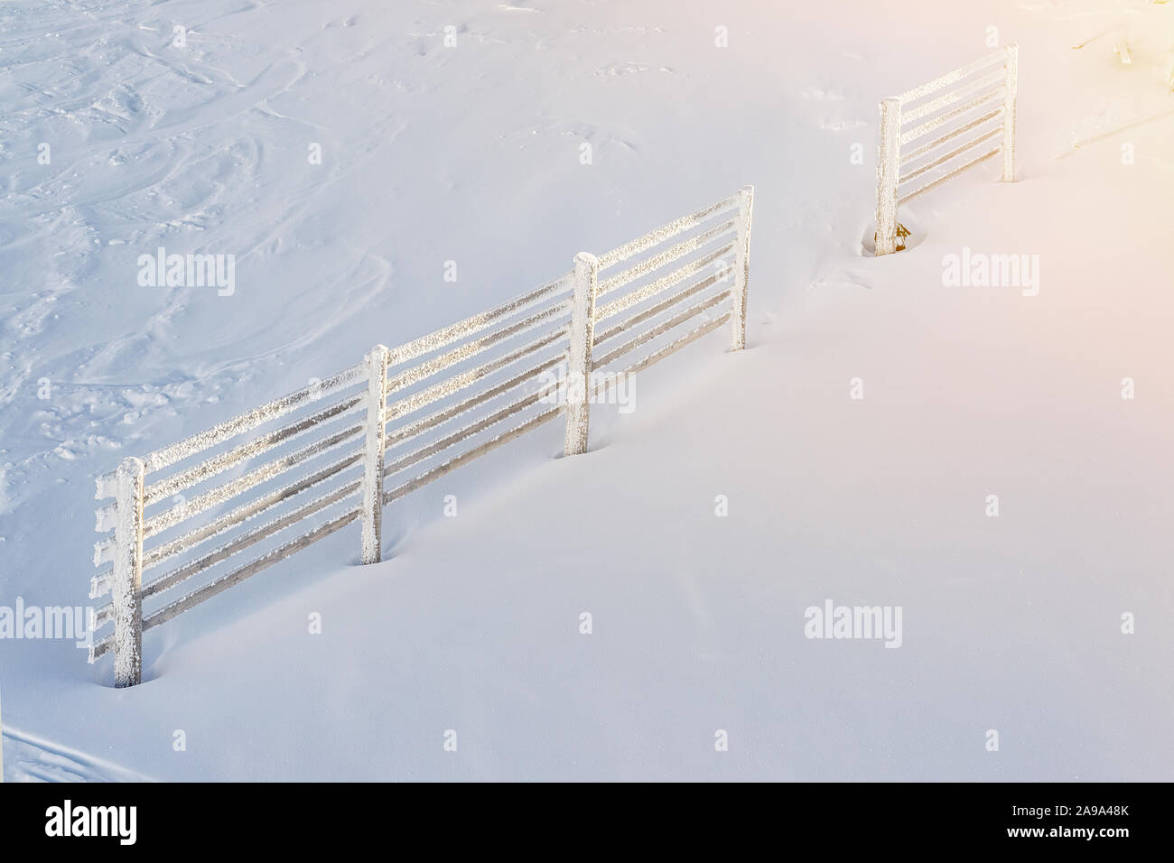 Scenic alpine mountain peak with thick snow layer with icing covered ...