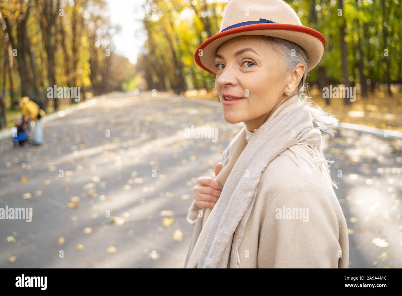 Pleasant woman in a stylish woolen coat Stock Photo - Alamy